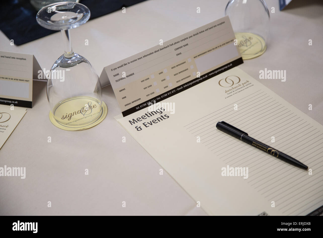 A table in a conference room set up ready for a business presentation ...