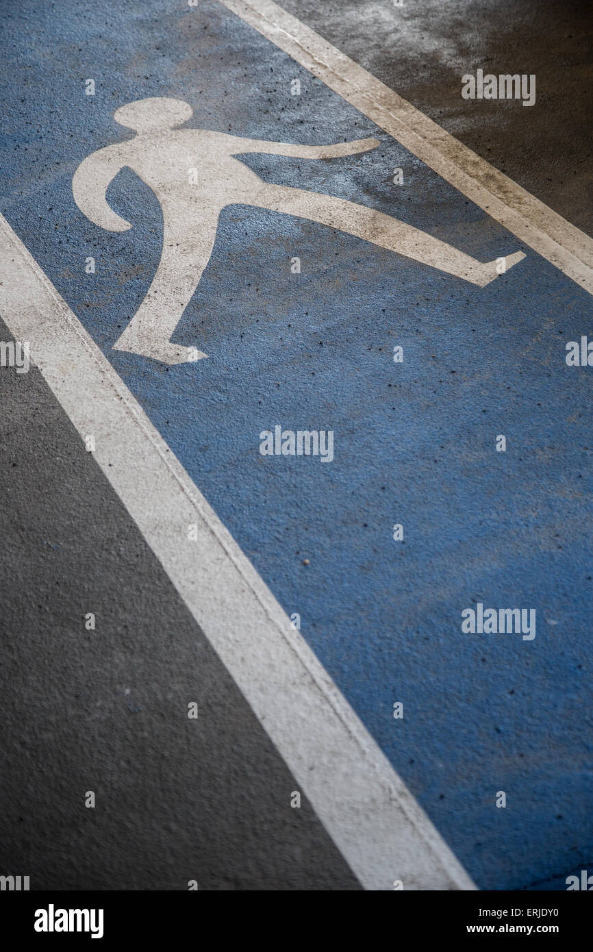 Pedestrian walkway marked in blue in a UK multi storey car park Stock ...