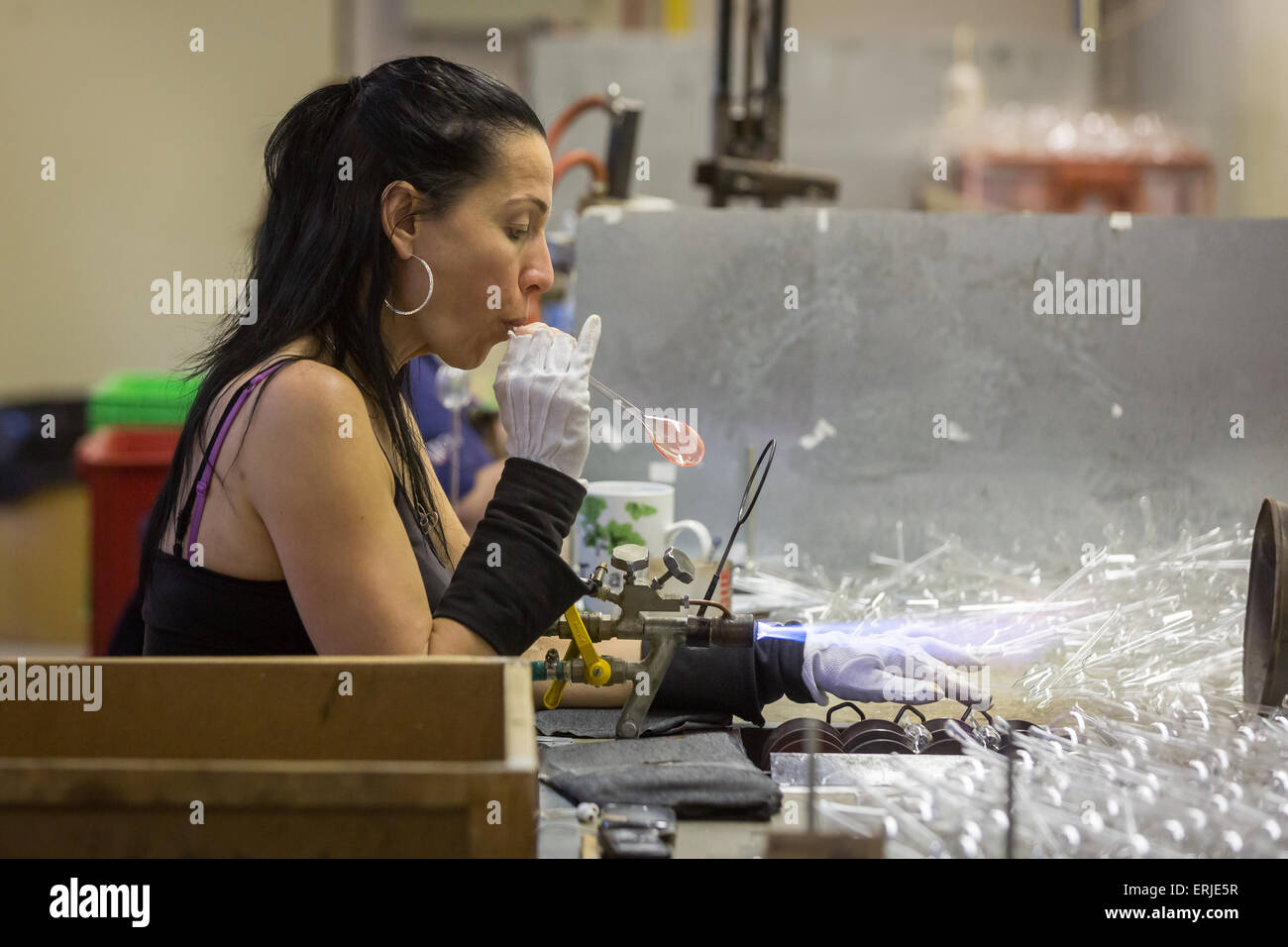 Worker completes glass ornaments in Slezska Tvorba factory in Opava ...
