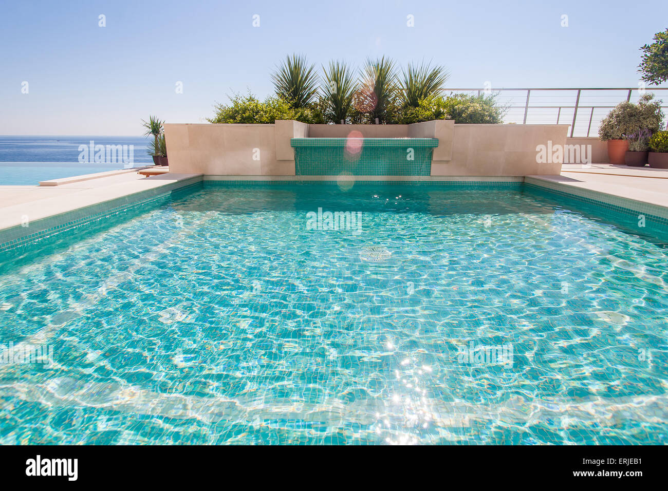 Luxury swimming pool and blue water Stock Photo - Alamy