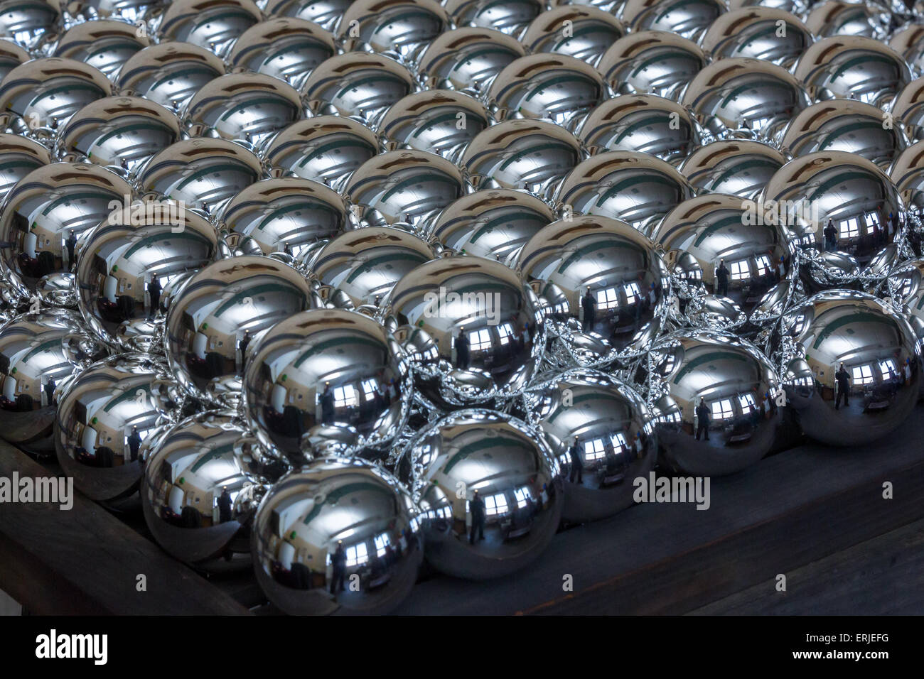Worker completes glass ornaments in Slezska Tvorba factory in Opava ...