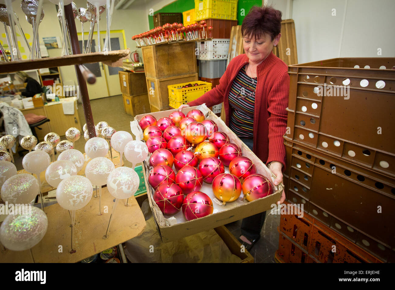 Worker completes glass ornaments in Slezska Tvorba factory in Opava ...