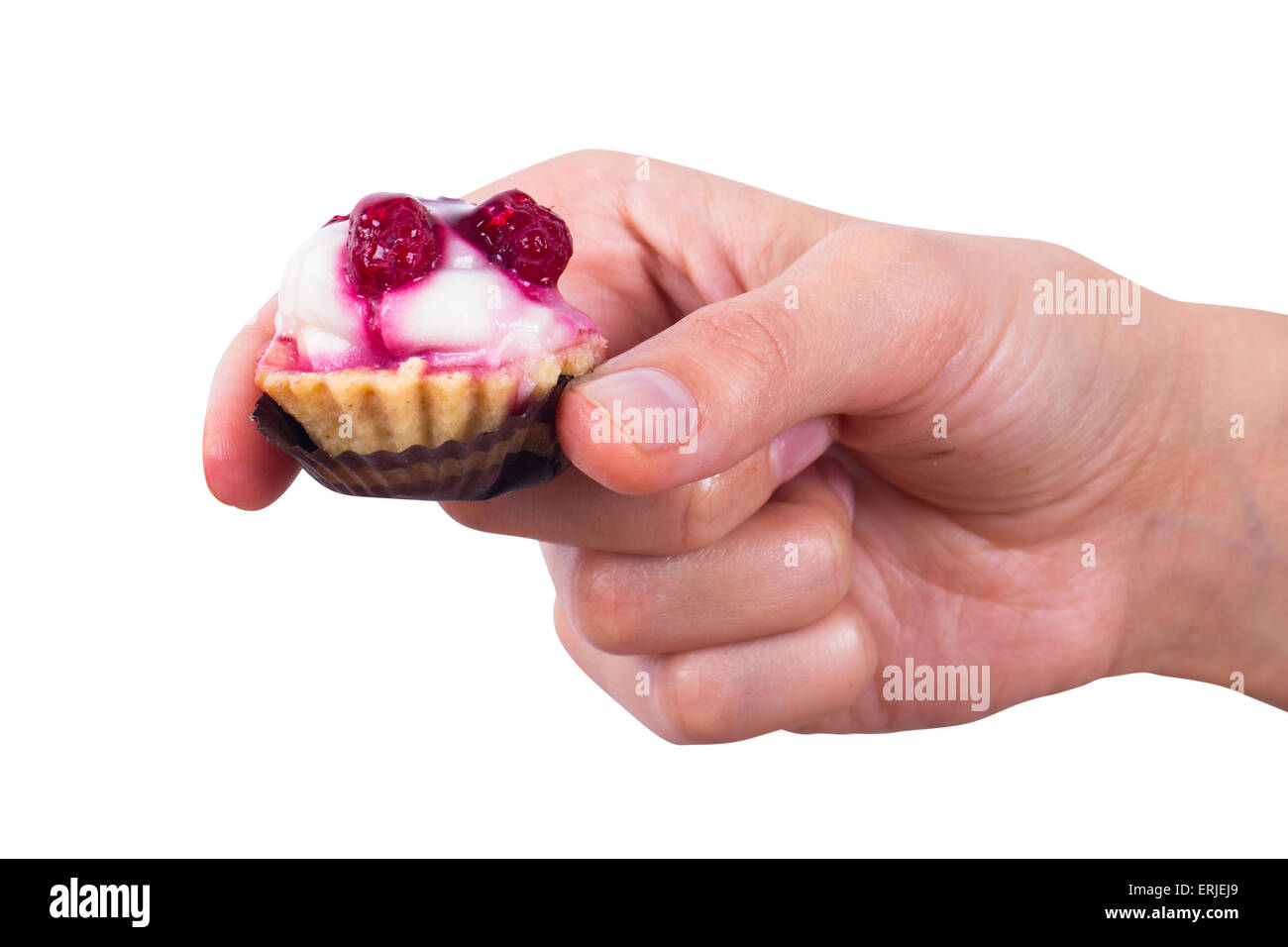 Female hand holding single cake, isolated on white background Stock ...