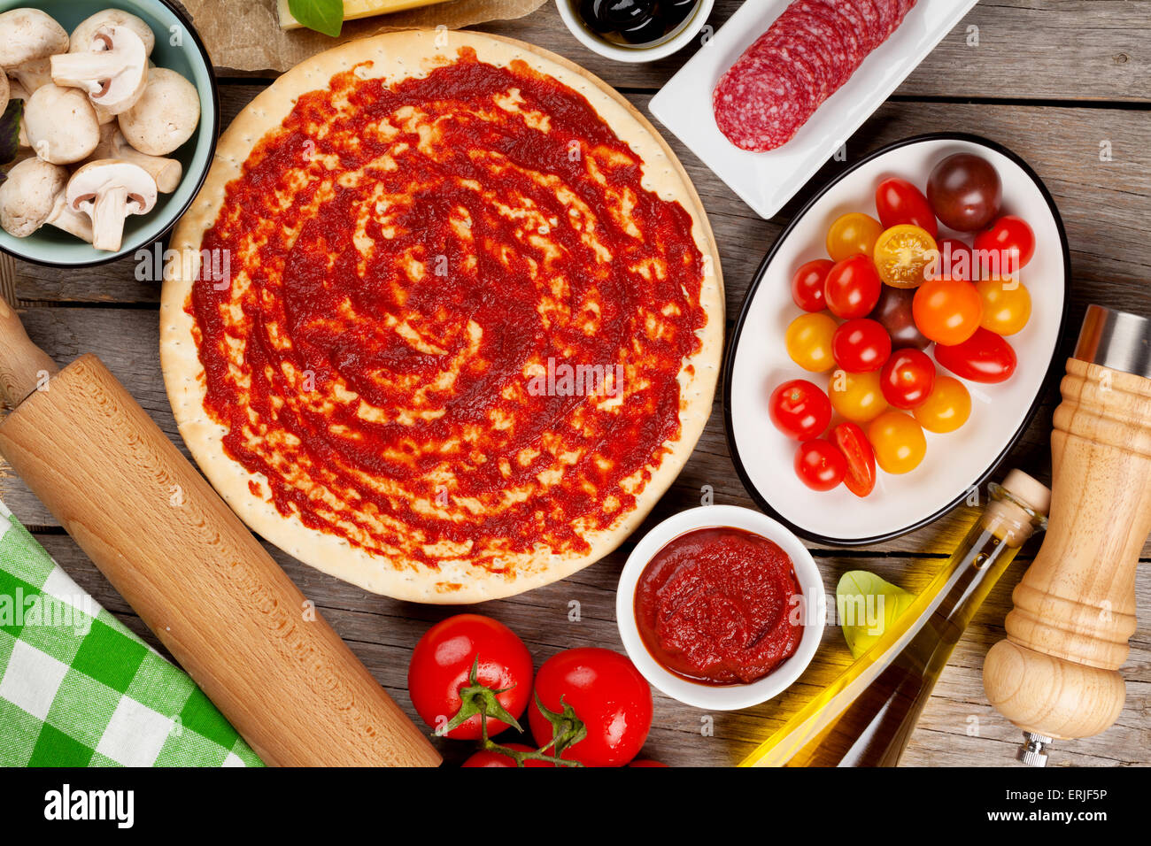 Pizza cooking ingredients. Dough, vegetables and spices Stock Photo - Alamy