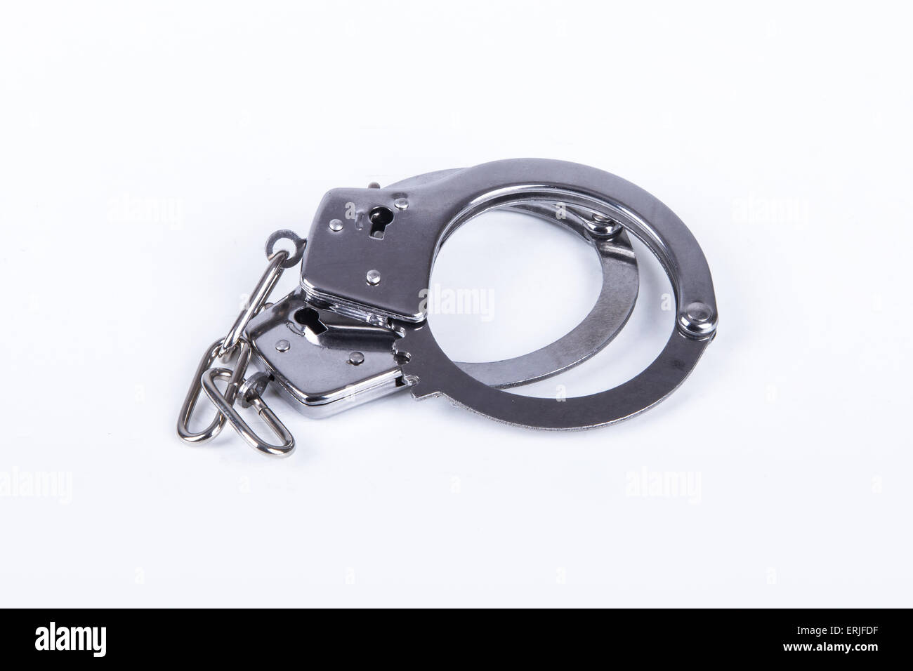 Handcuffs, isolated on white background Stock Photo - Alamy