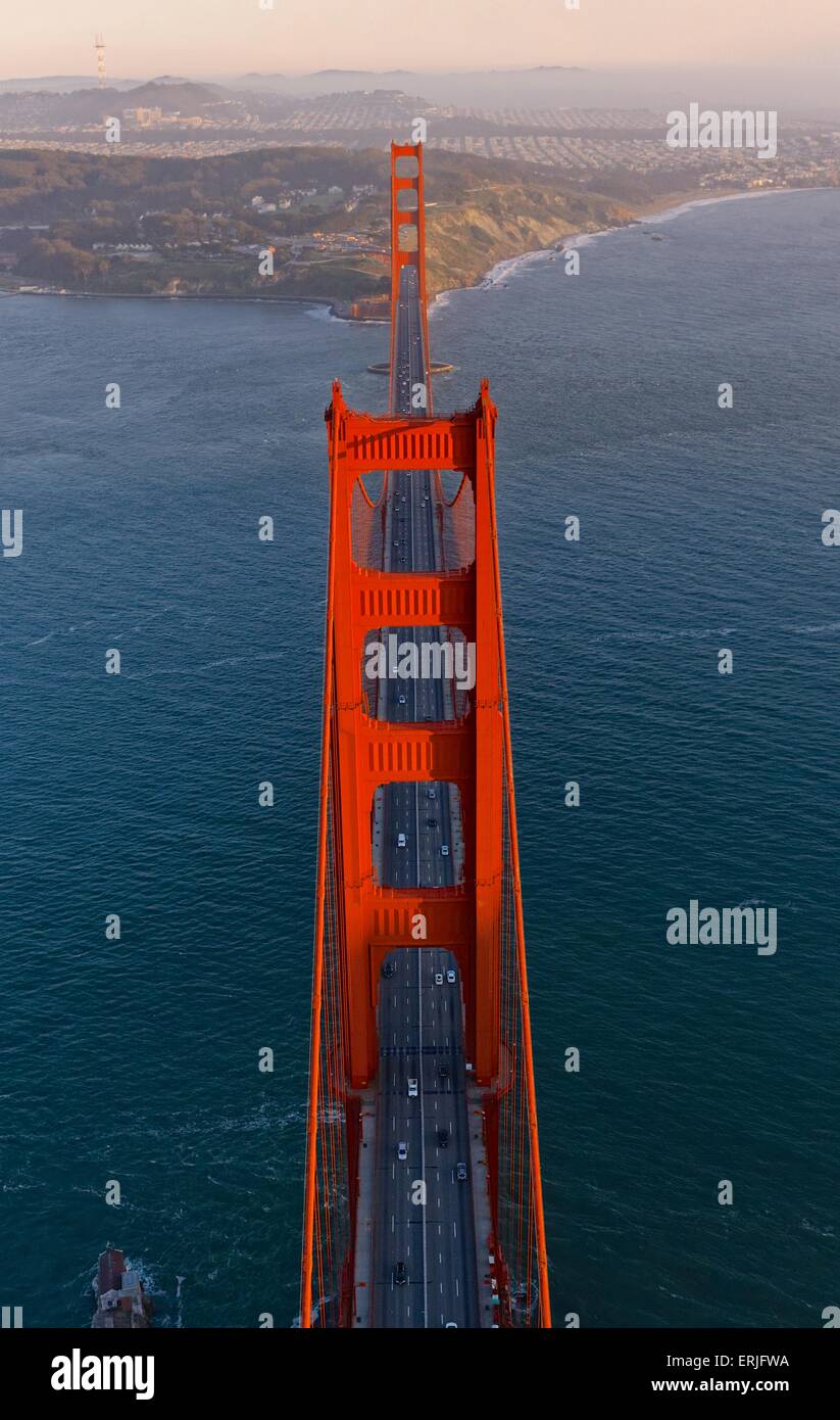 Aerial view over San Francisco and the Golden Gate Bridge at sunset ...