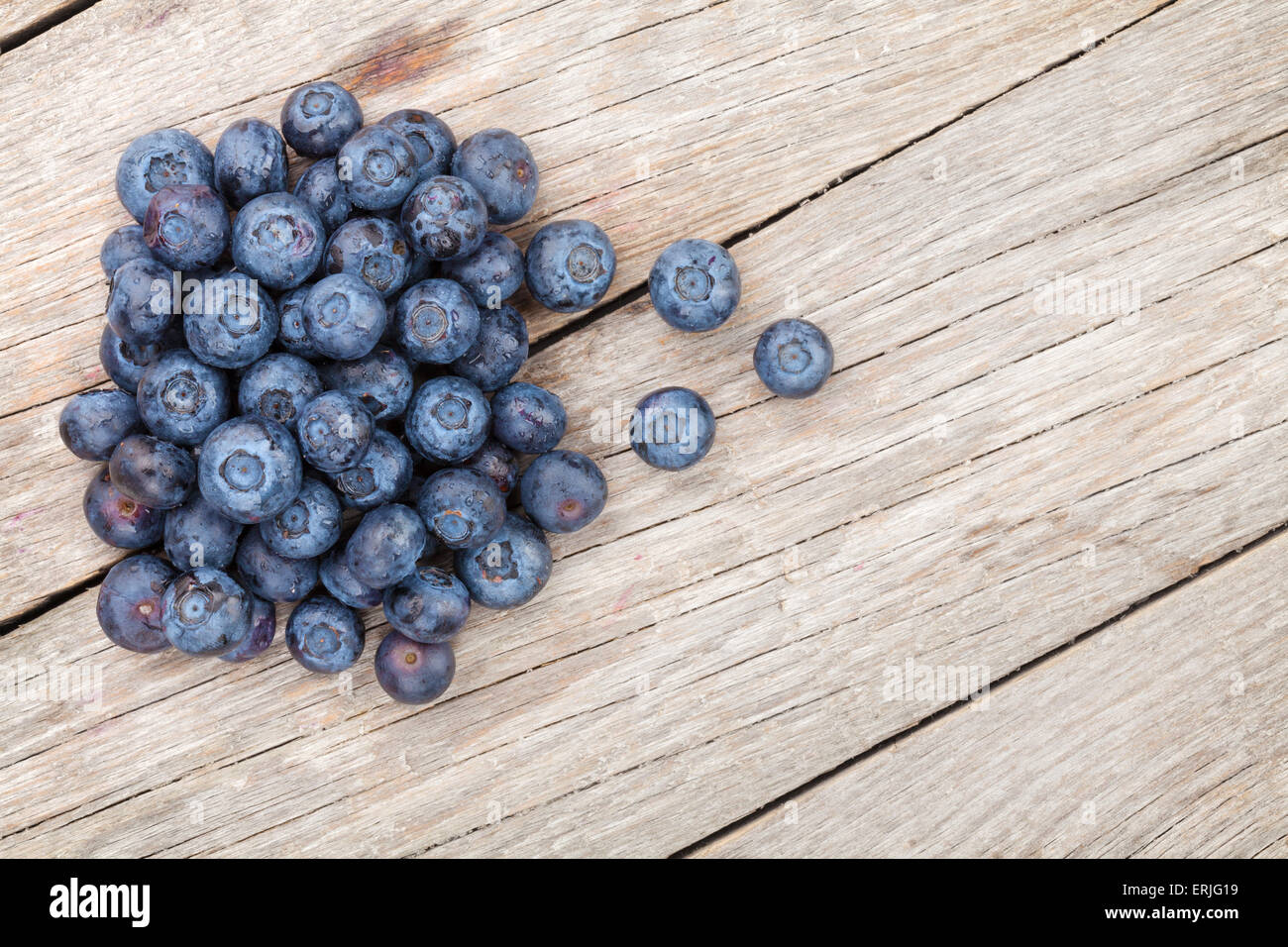 Blueberries on wooden table background with copy space Stock Photo - Alamy