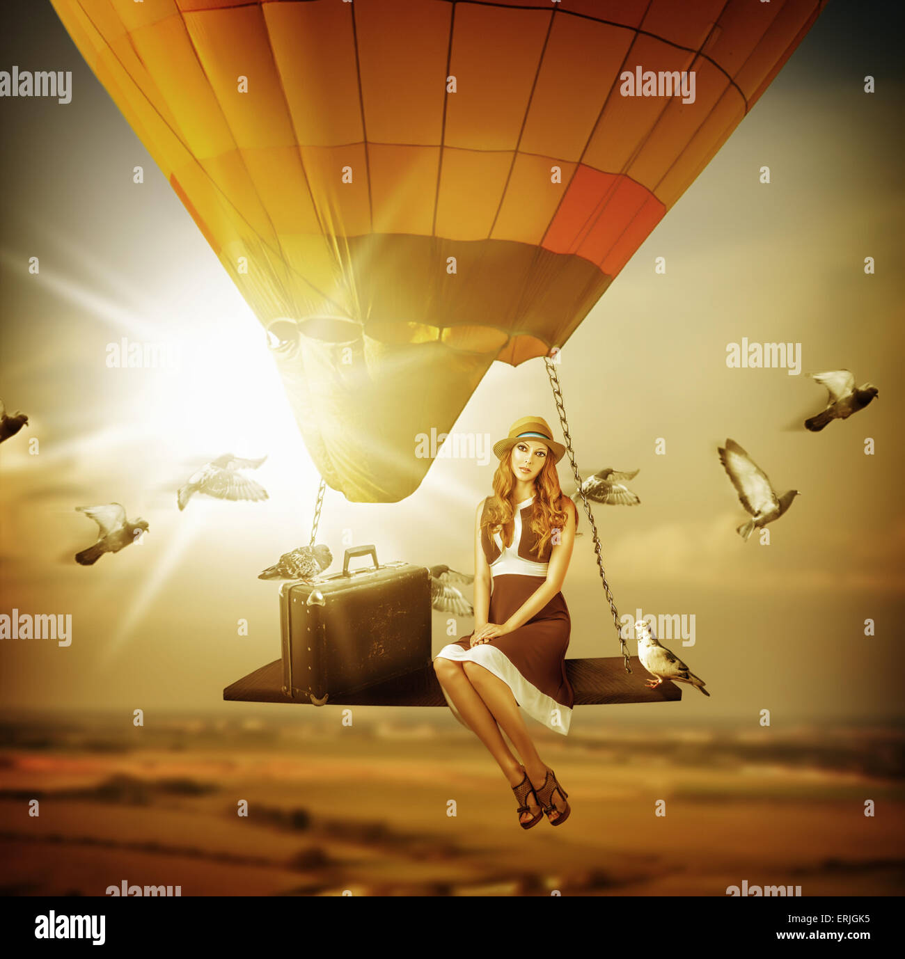 Fantasy travel. Young woman flying a balloon Stock Photo - Alamy