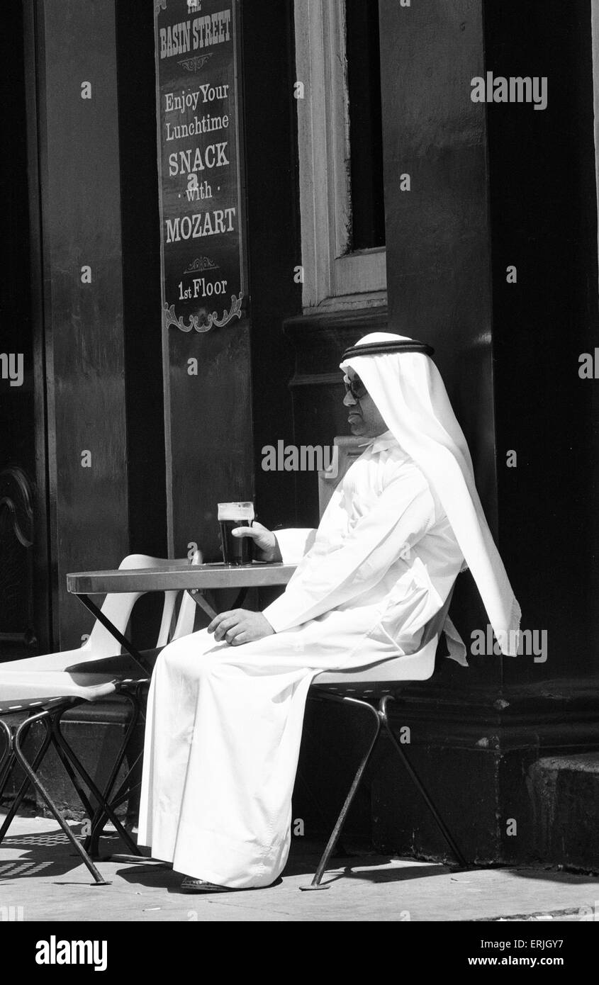 Arab man sitting outside enjoying a pint of Guinness at the Stanhope ...
