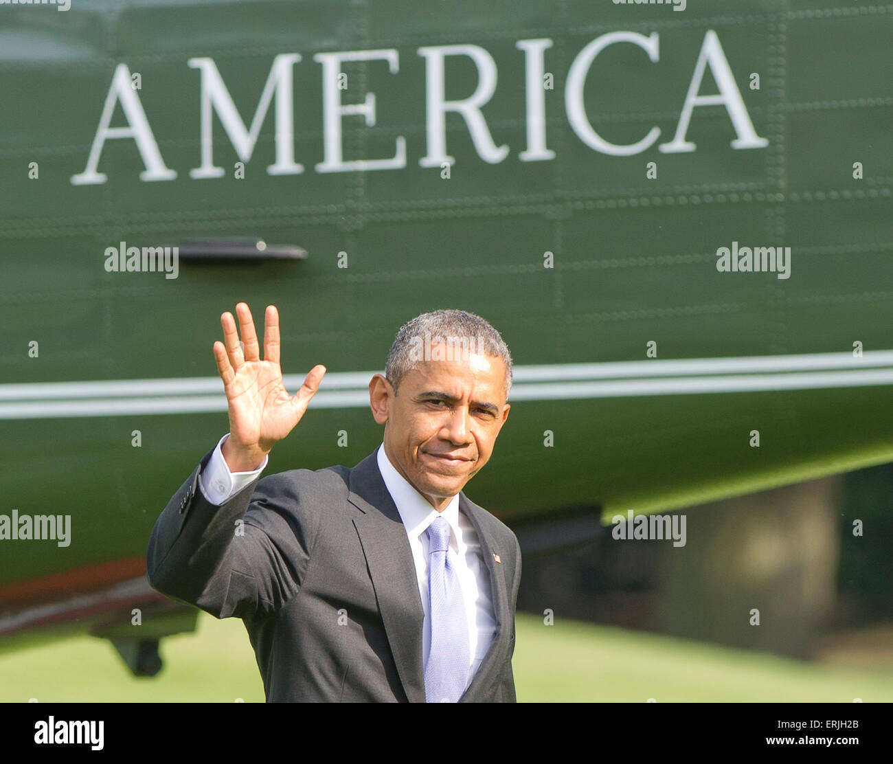 United States President Barack Obama waves to the photographers as he ...