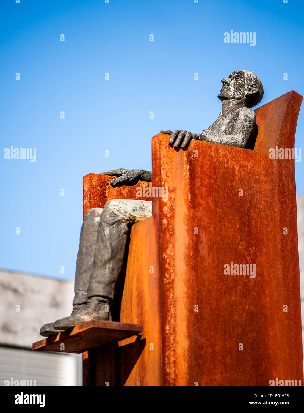 Monument man sitting in a chair and staring at the sky in Vaduz Stock ...