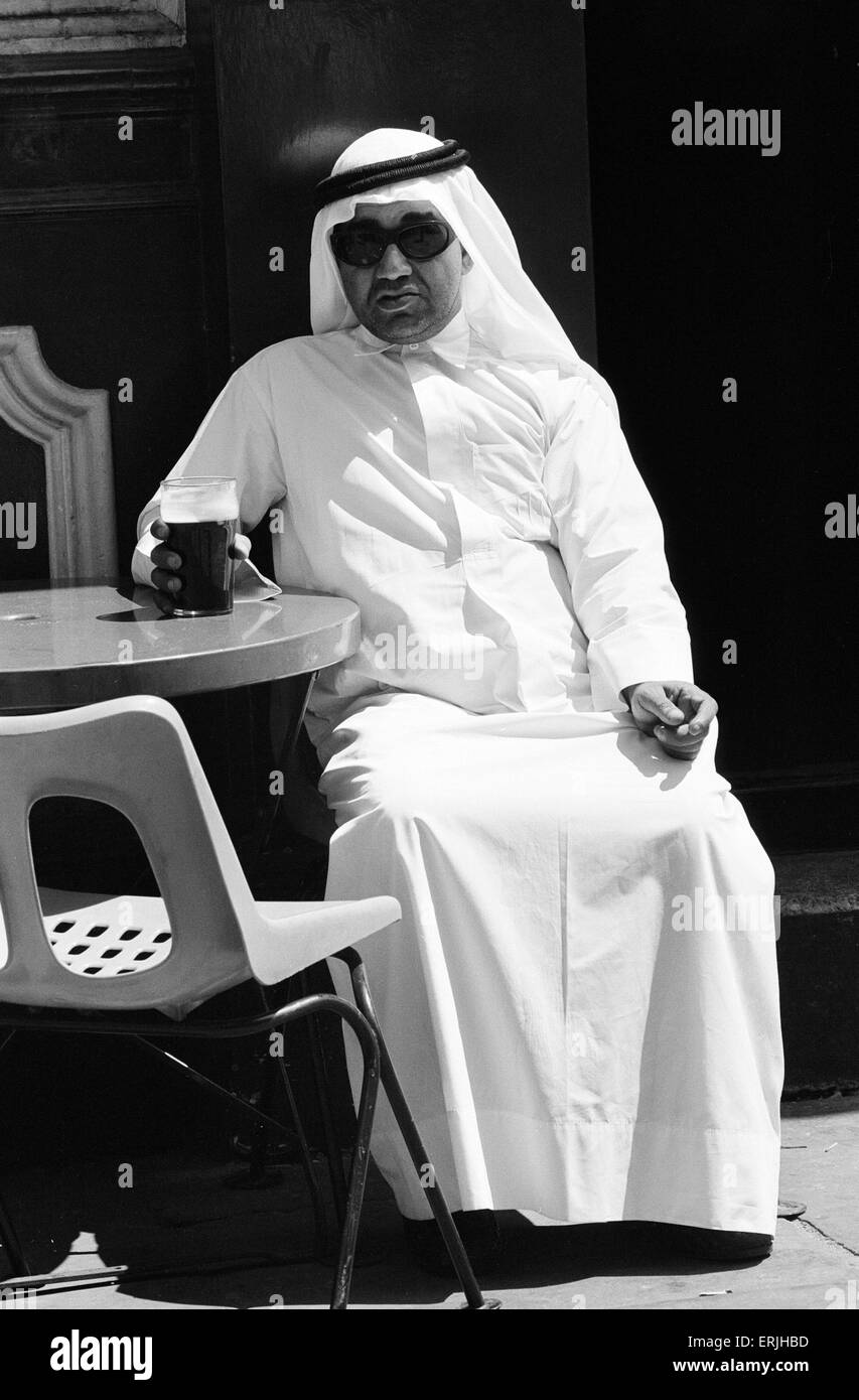 Arab man sitting outside enjoying a pint of Guinness at the Stanhope ...