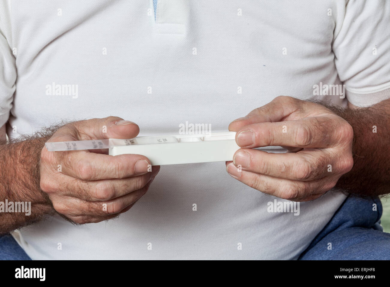 Senior man holding pill box hi-res stock photography and images - Alamy