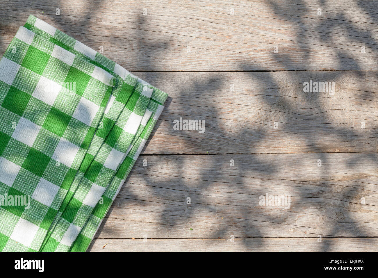 Empty wooden garden table with tablecloth. Top view with copy space ...