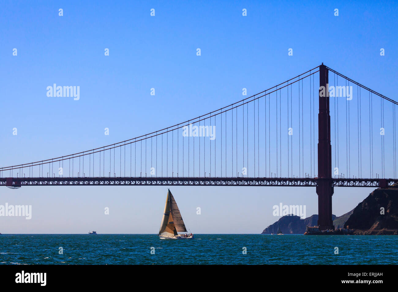 Sailboat glides across San Francisco Bay under Golden Gate Bridge on ...