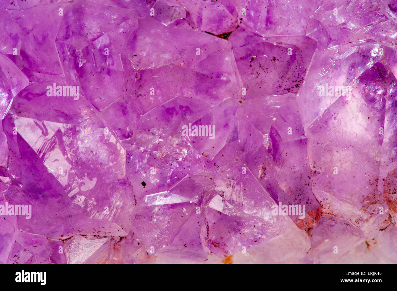 Amethyst raw stone background Stock Photo - Alamy