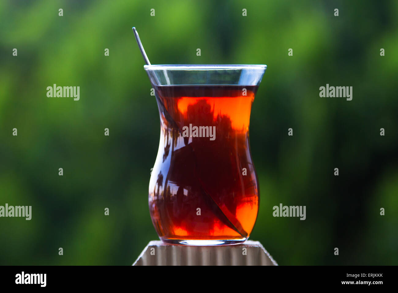 Tea in glass on blurry, natural background Stock Photo - Alamy