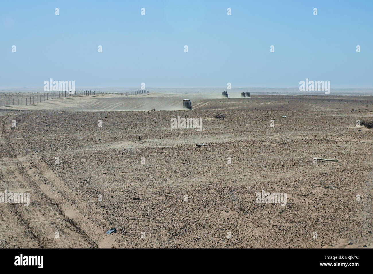 On a paid for guided overland tour a convoy of 4x4 vehicle drive a ...