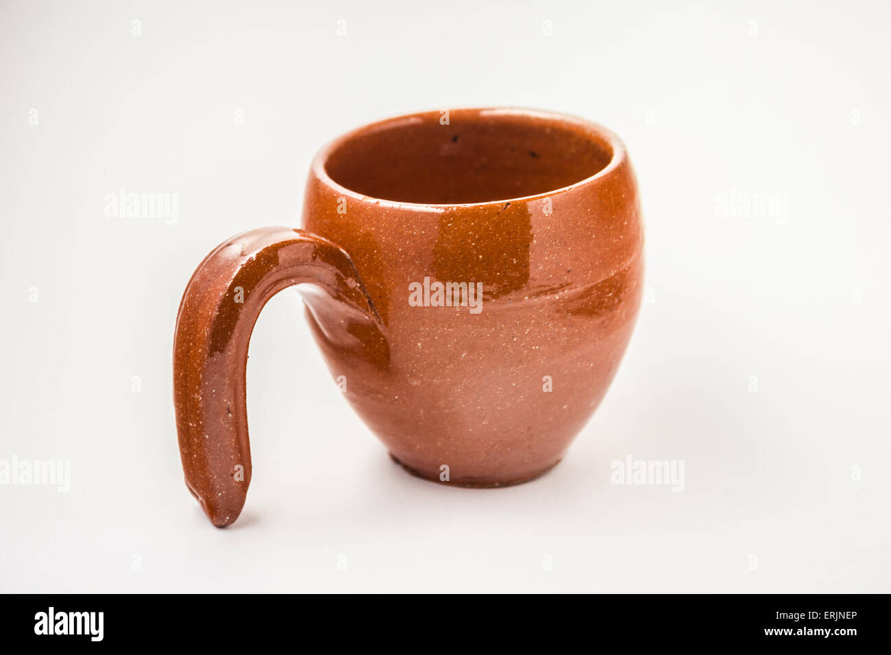 Old clay cup isolated on white background Stock Photo - Alamy