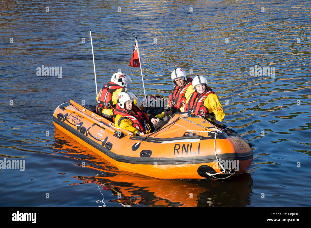 Whitby RNLI crew practice life saving in the harbour on a sunny ...