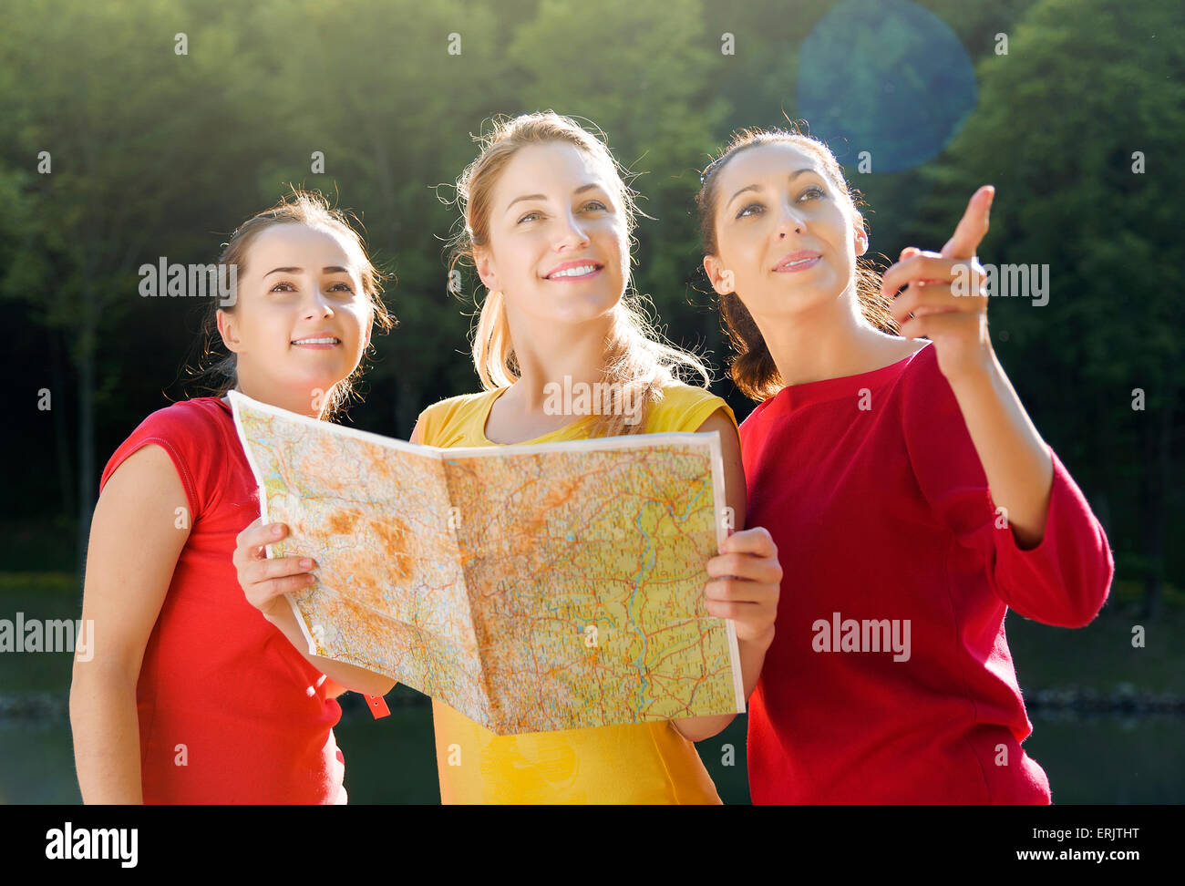 Girls with map Stock Photo - Alamy