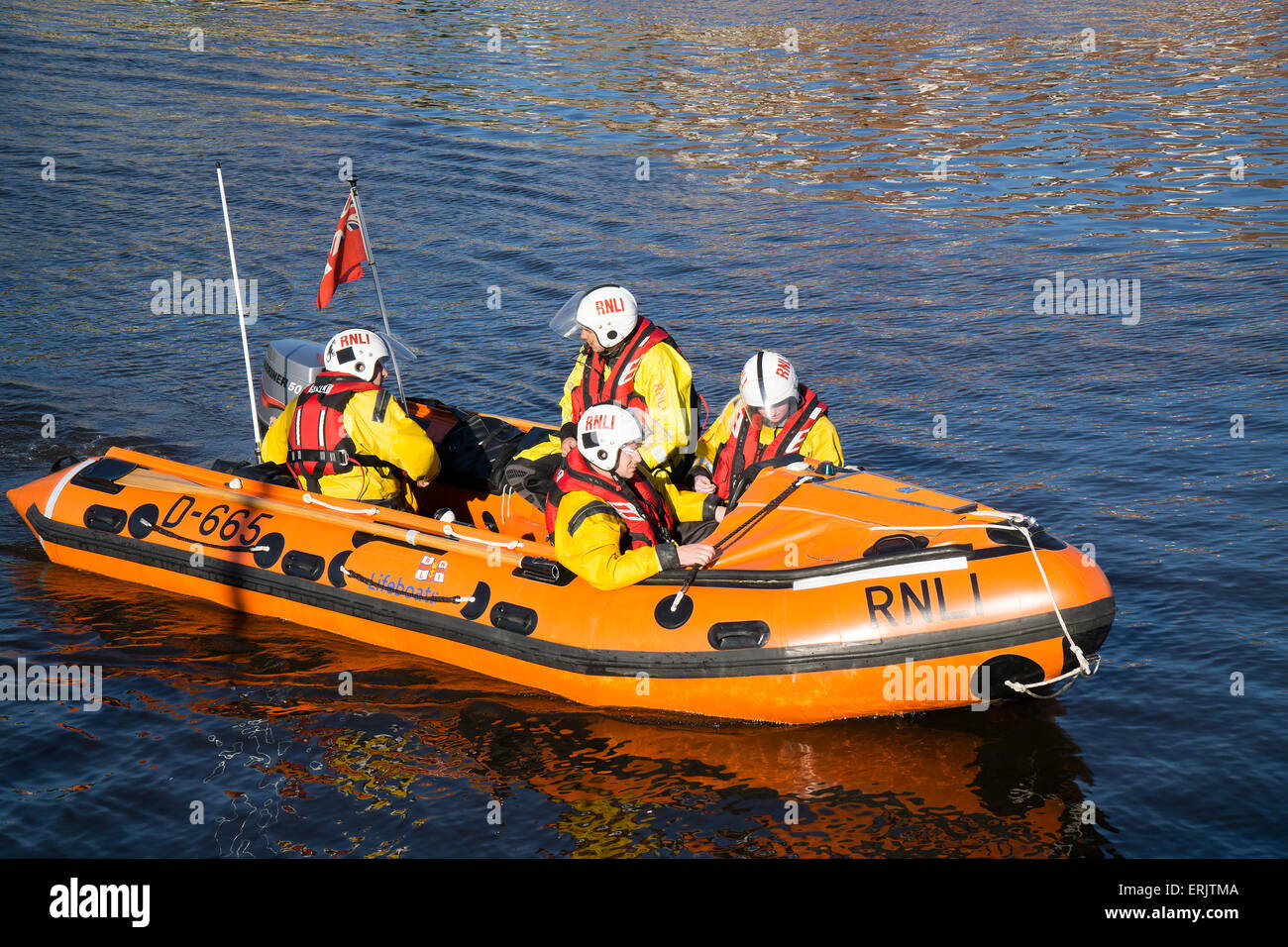 Whitby RNLI crew practice life saving in the harbour on a sunny ...