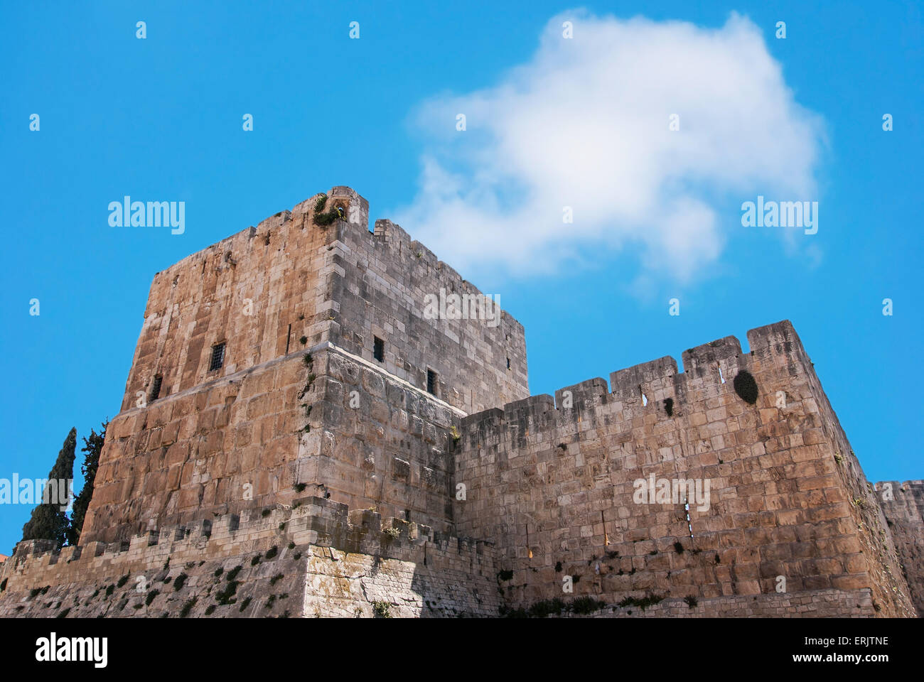 Defensive wall of the ancient holy Jerusalem, lit by the bright sun ...