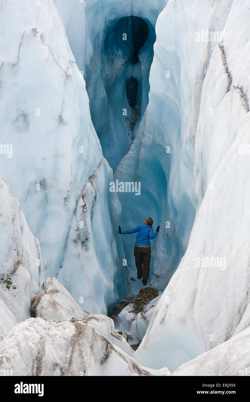 Woman looking into chasm in glacier near McCarthy, Alaska Stock Photo ...