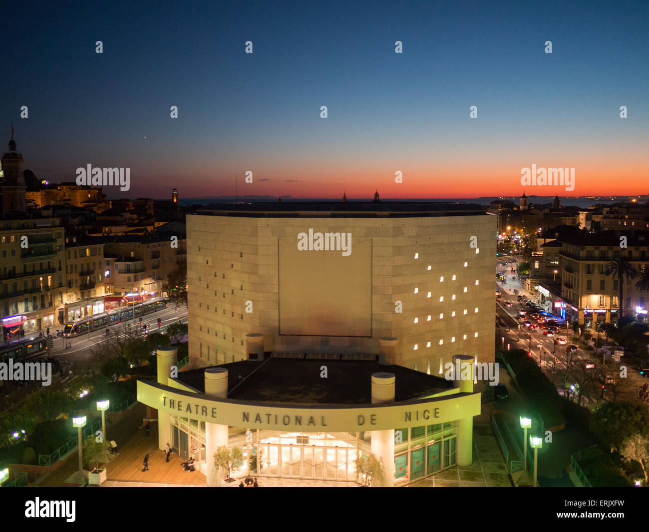Théâtre National de Nice building seen at night with the city in ...