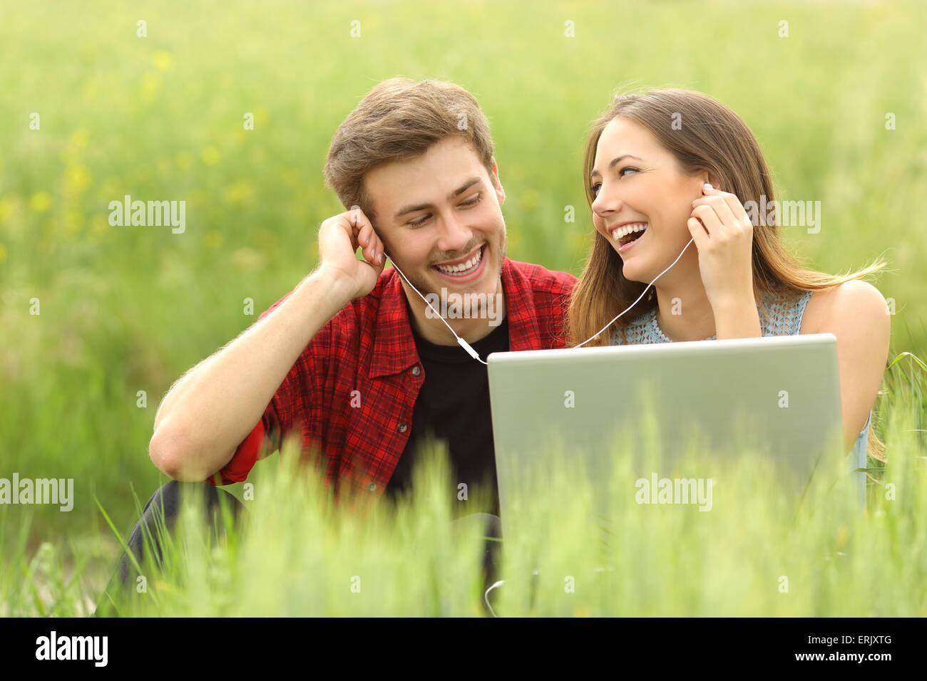 Teens sharing earbuds hi-res stock photography and images - Alamy