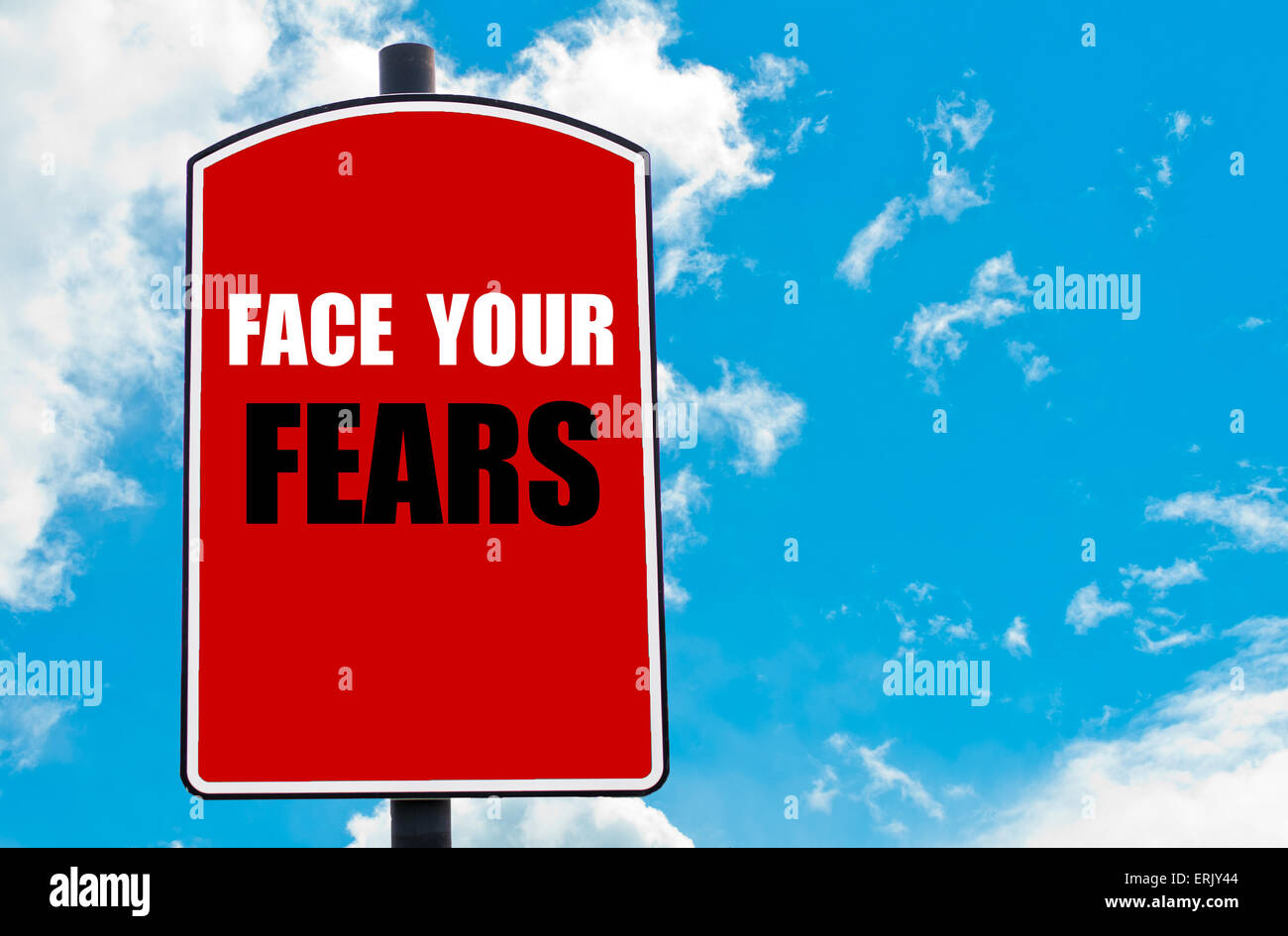 Face Your Fears motivational quote written on red road sign isolated ...