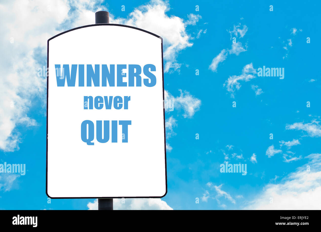 Winners Never Quit motivational quote written on white road sign ...