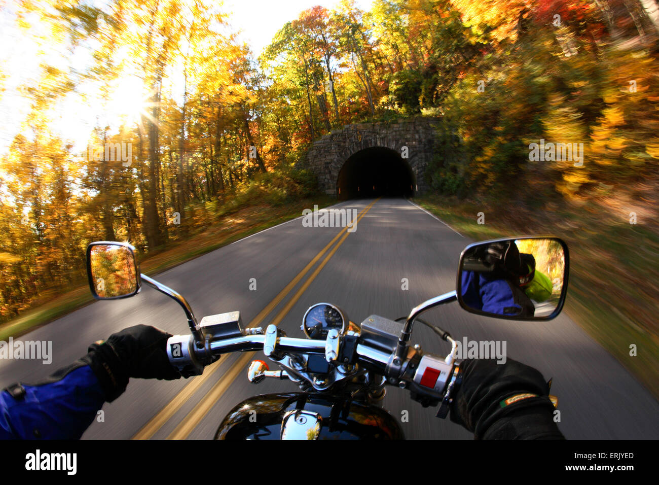 Motorcycle rider out for a cruise on a beautiful fall day on the Blue ...