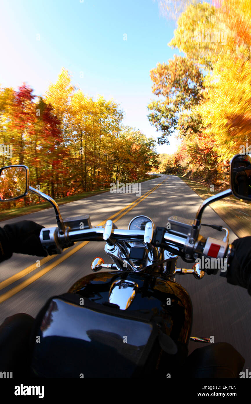 Motorcycle rider out for a cruise on a beautiful fall day on the Blue ...