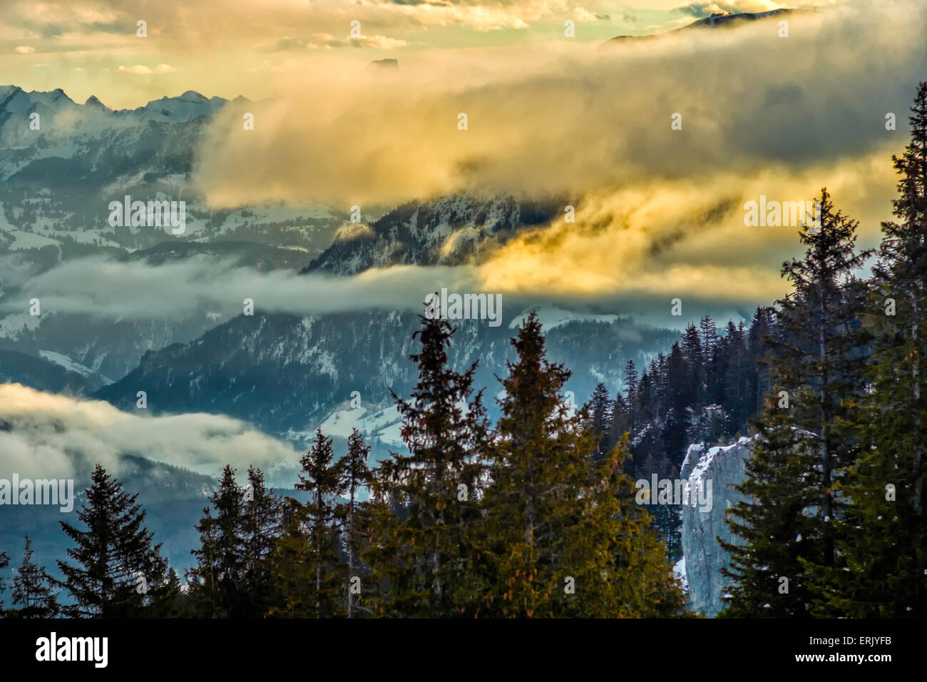 Sunrise above clouds in Swiss Alps Stock Photo - Alamy