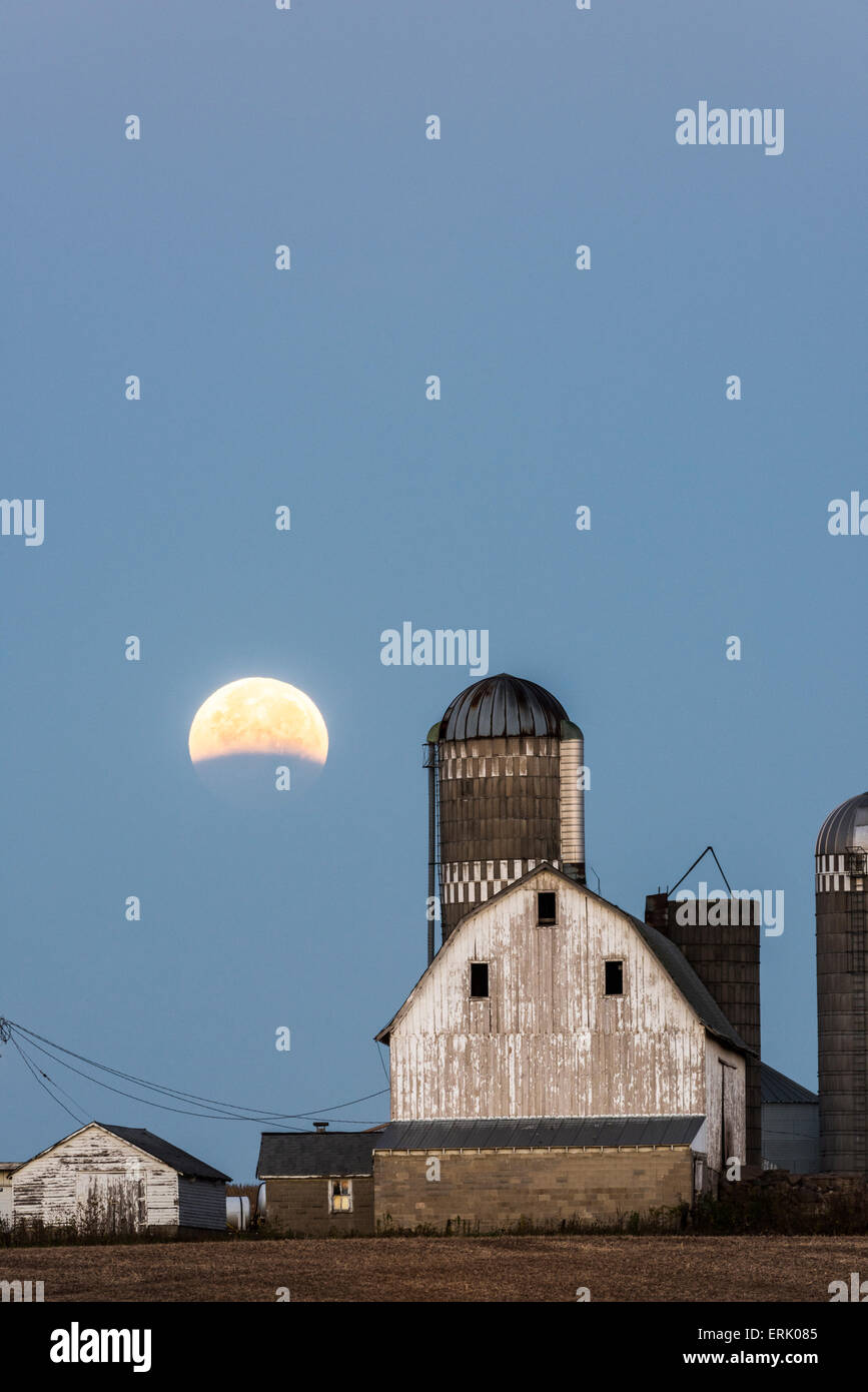 Partial lunar eclipse over farm buildings near Shakopee, Minnesota ...