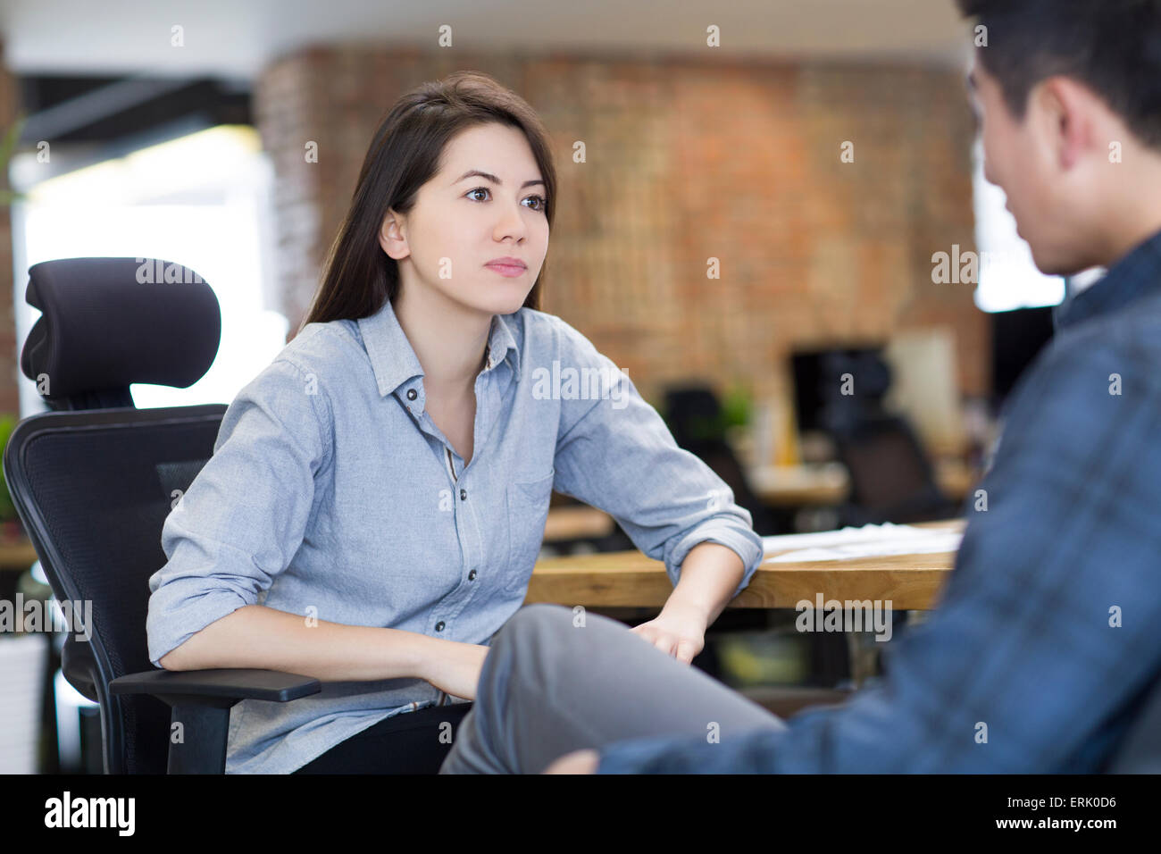 IT workers talking in office Stock Photo - Alamy