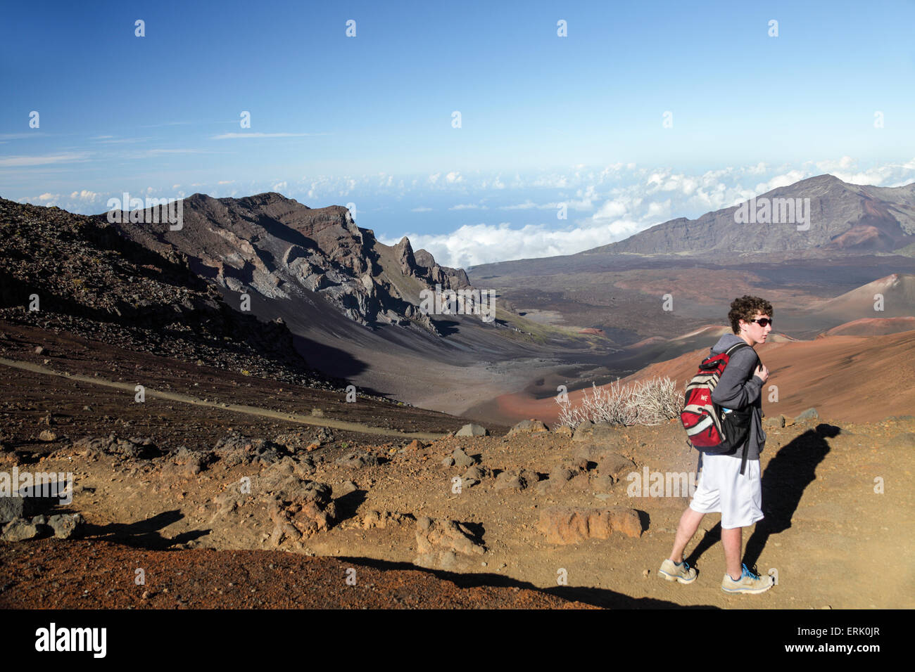 Teenager hiking on the Sliding Sands Trail at Haleakala National Park ...