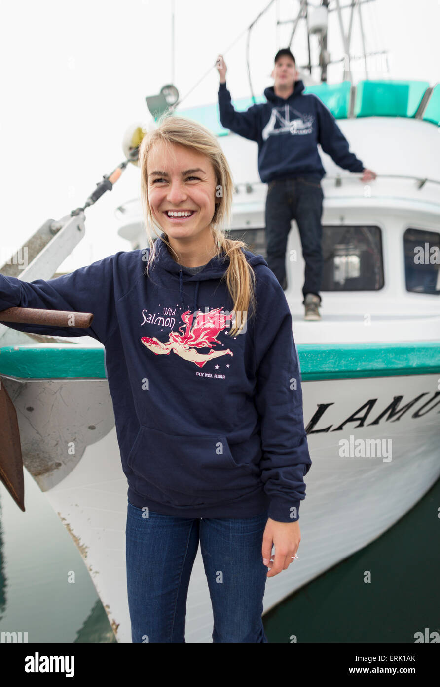 Young adults working on a boat in the fishing town of Homer, Kenai ...