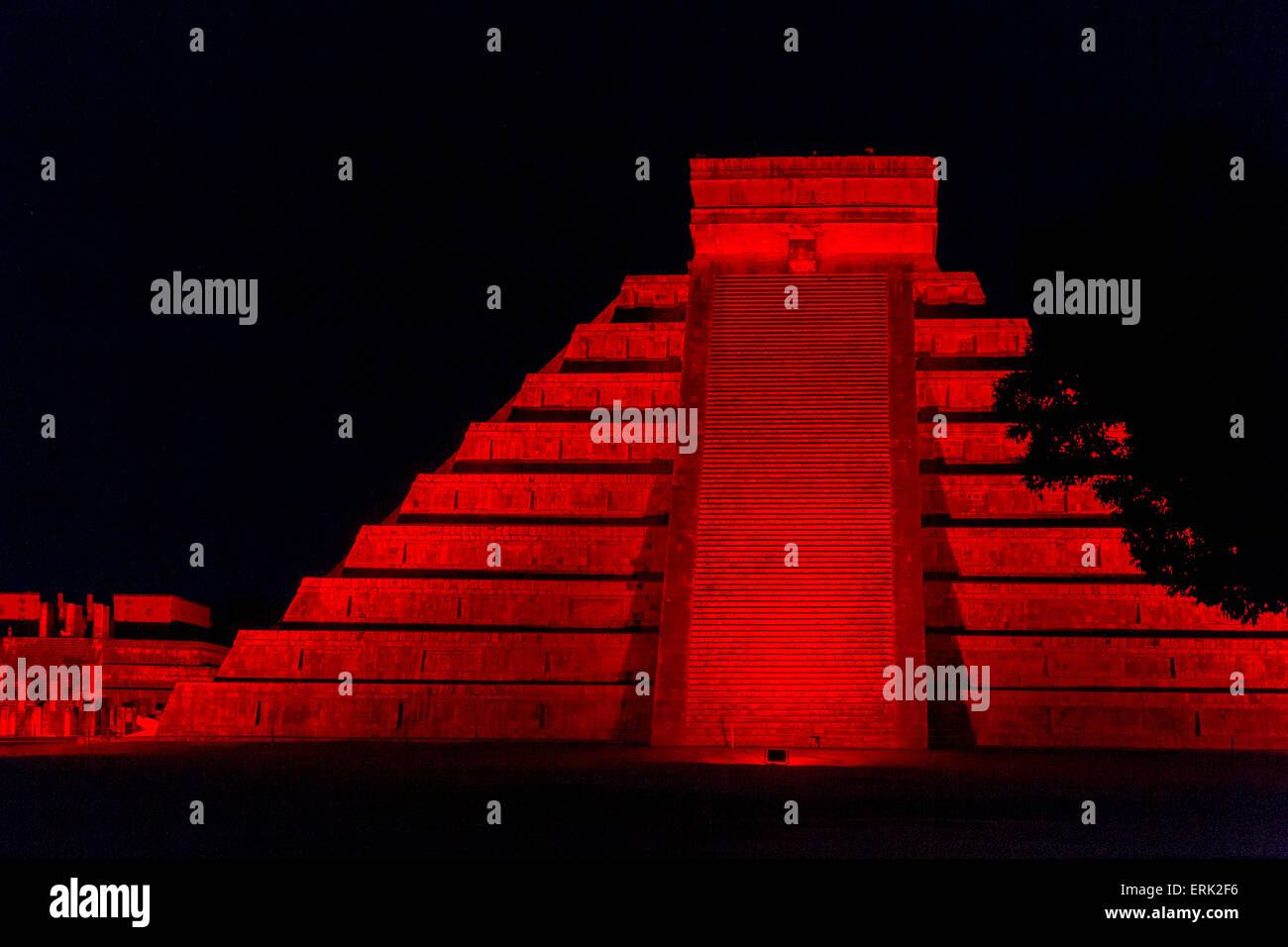 Ancient Mayan Pyramid at night illuminated with red light; Chichen Itza ...
