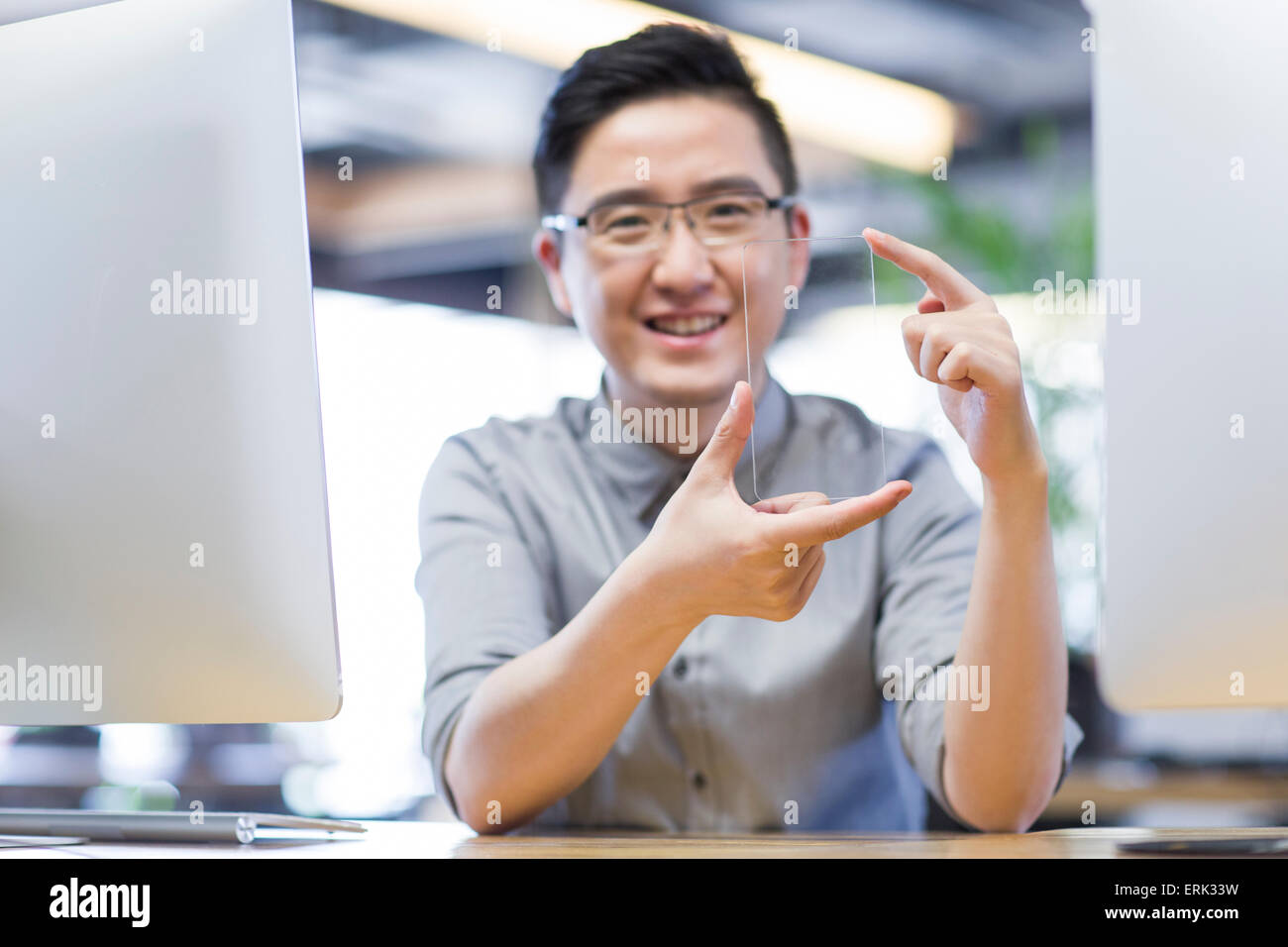 IT worker developing smart phone Stock Photo - Alamy