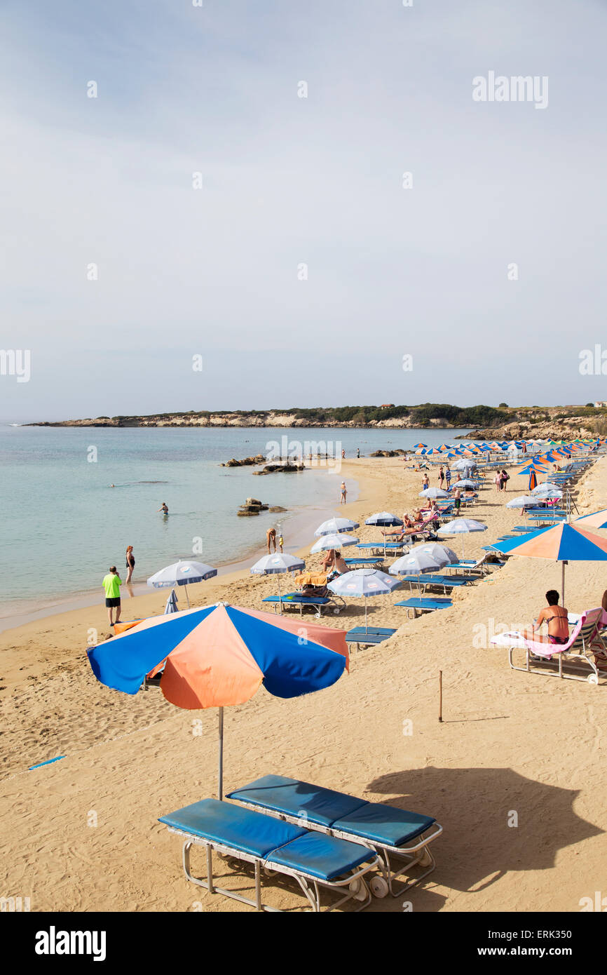 Sunbathing on the beach along the mediterranean; Peyia, Paphos, Cyprus ...