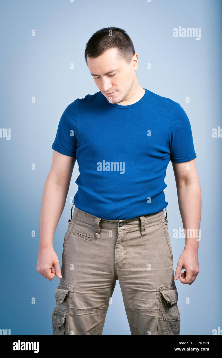 Portrait of an adult man standing with a sad face Stock Photo - Alamy