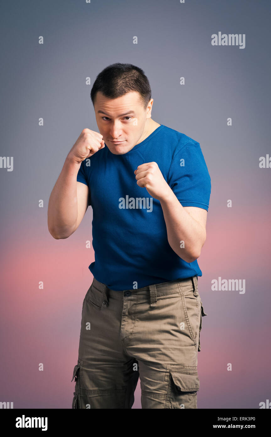 This is a photograph of a young man standing in a boxing position Stock ...