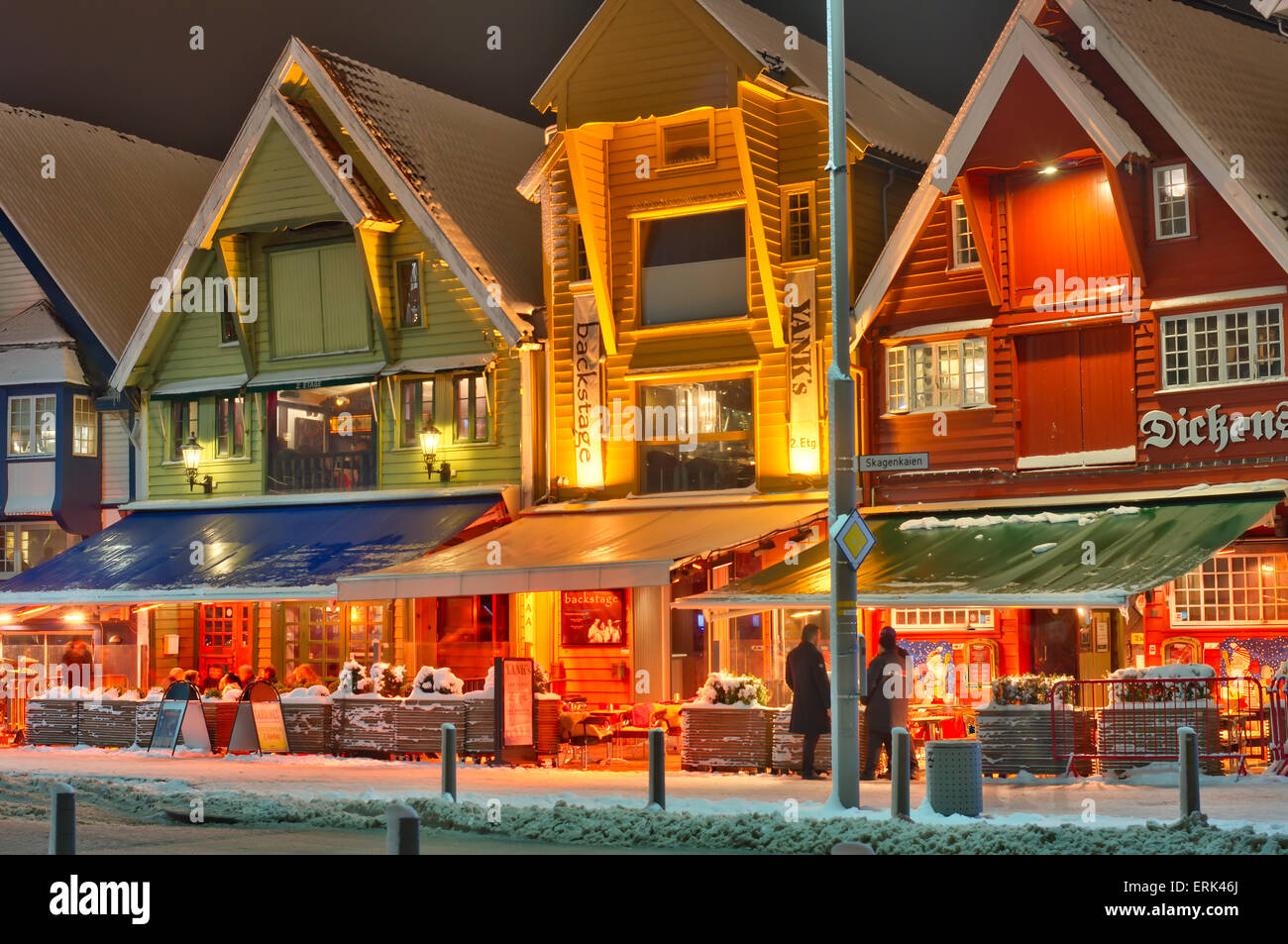 people sitting in front of a bar, winter, chrismas decoration, cold ...