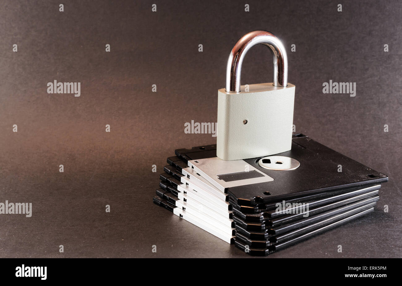 Locked data secure padlock with many floppy discs Stock Photo - Alamy