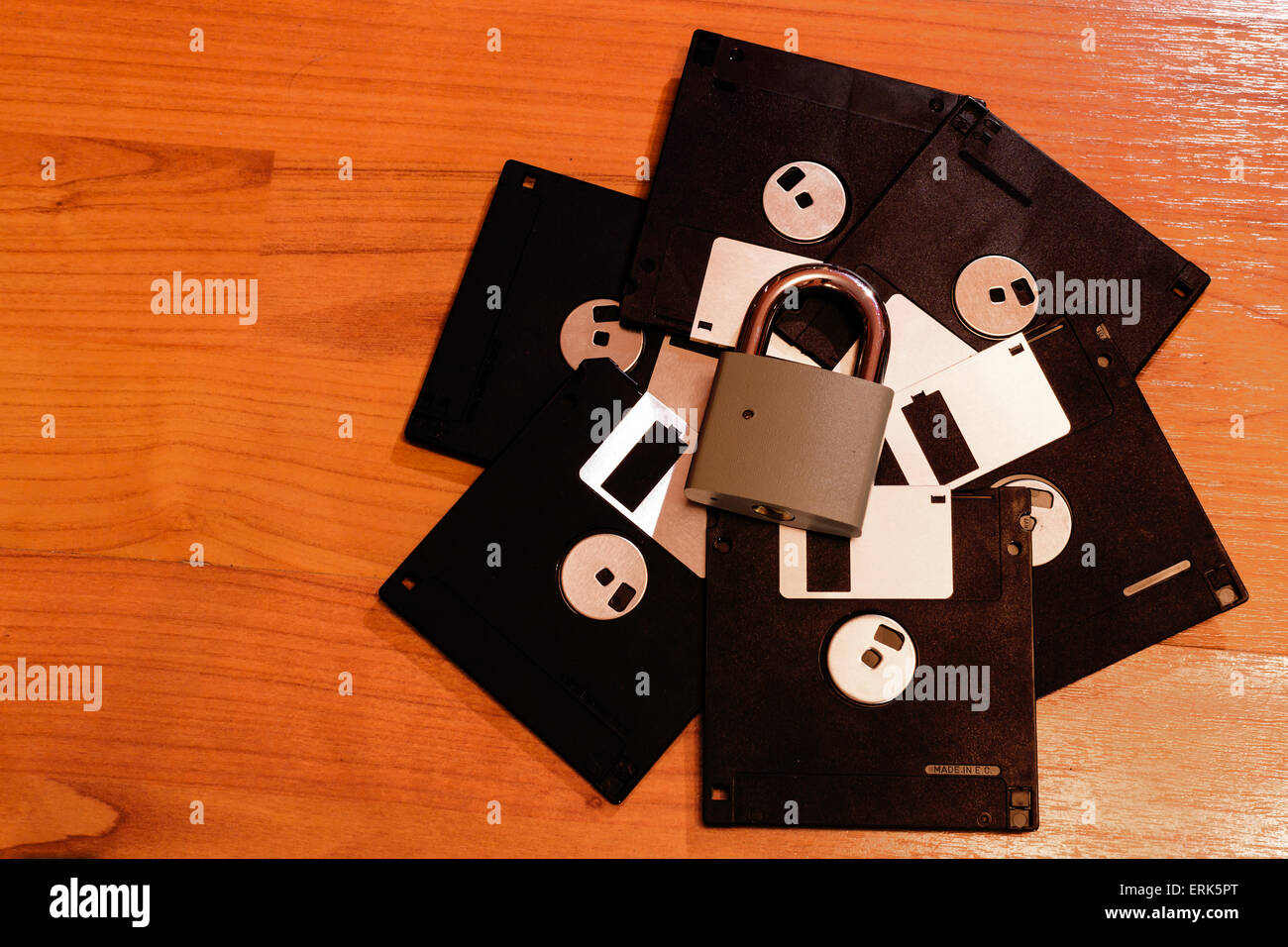Locked data secure padlock with many floppy discs Stock Photo - Alamy