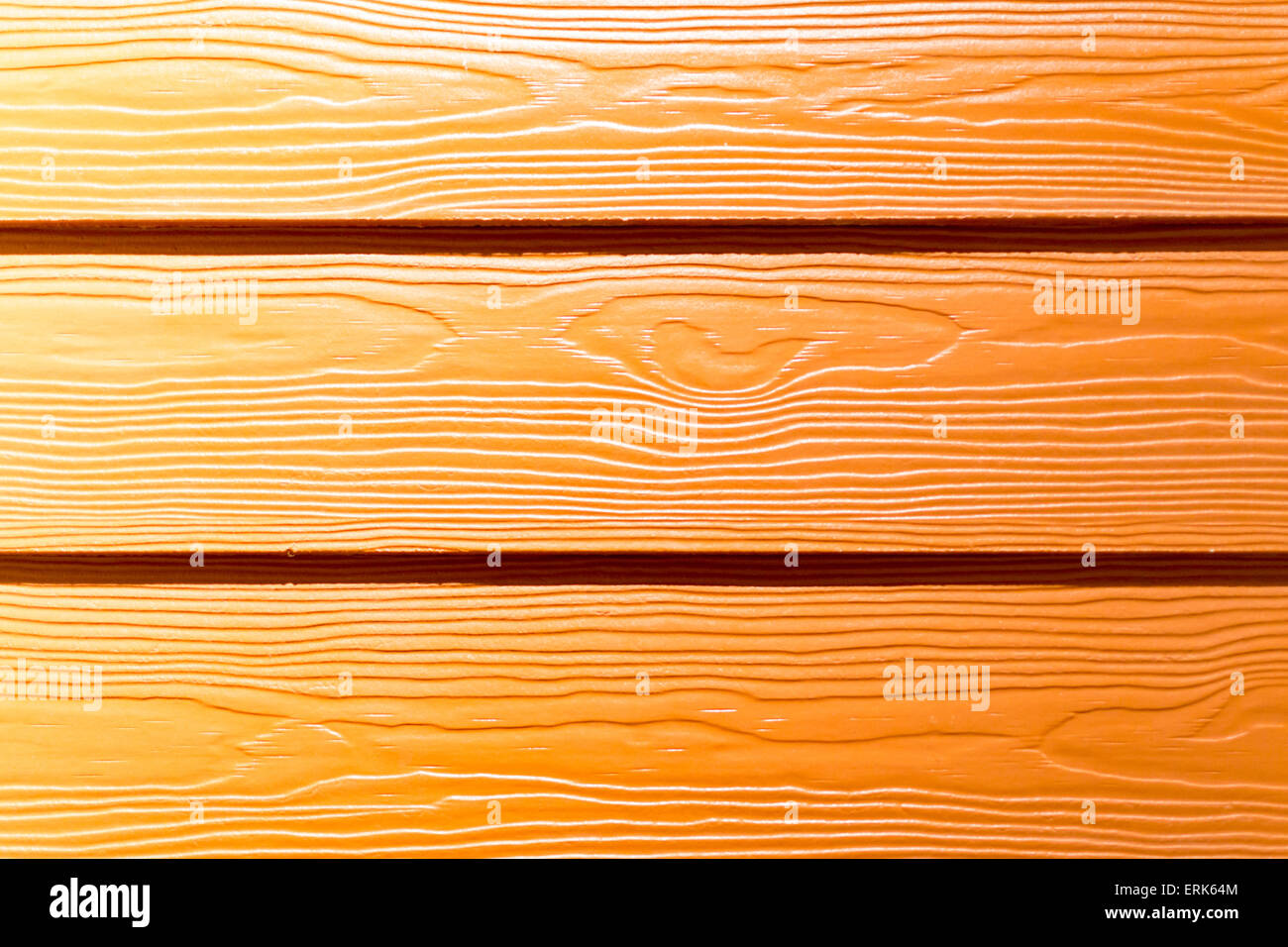 Golden colored plastic wood effect wall decoration Stock Photo - Alamy
