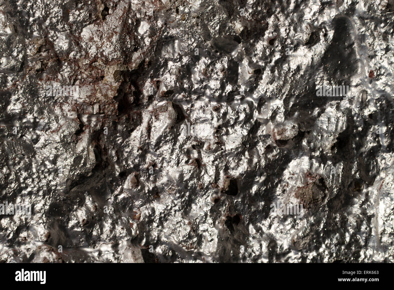 Sun baked silver paint on a brick wall Stock Photo - Alamy