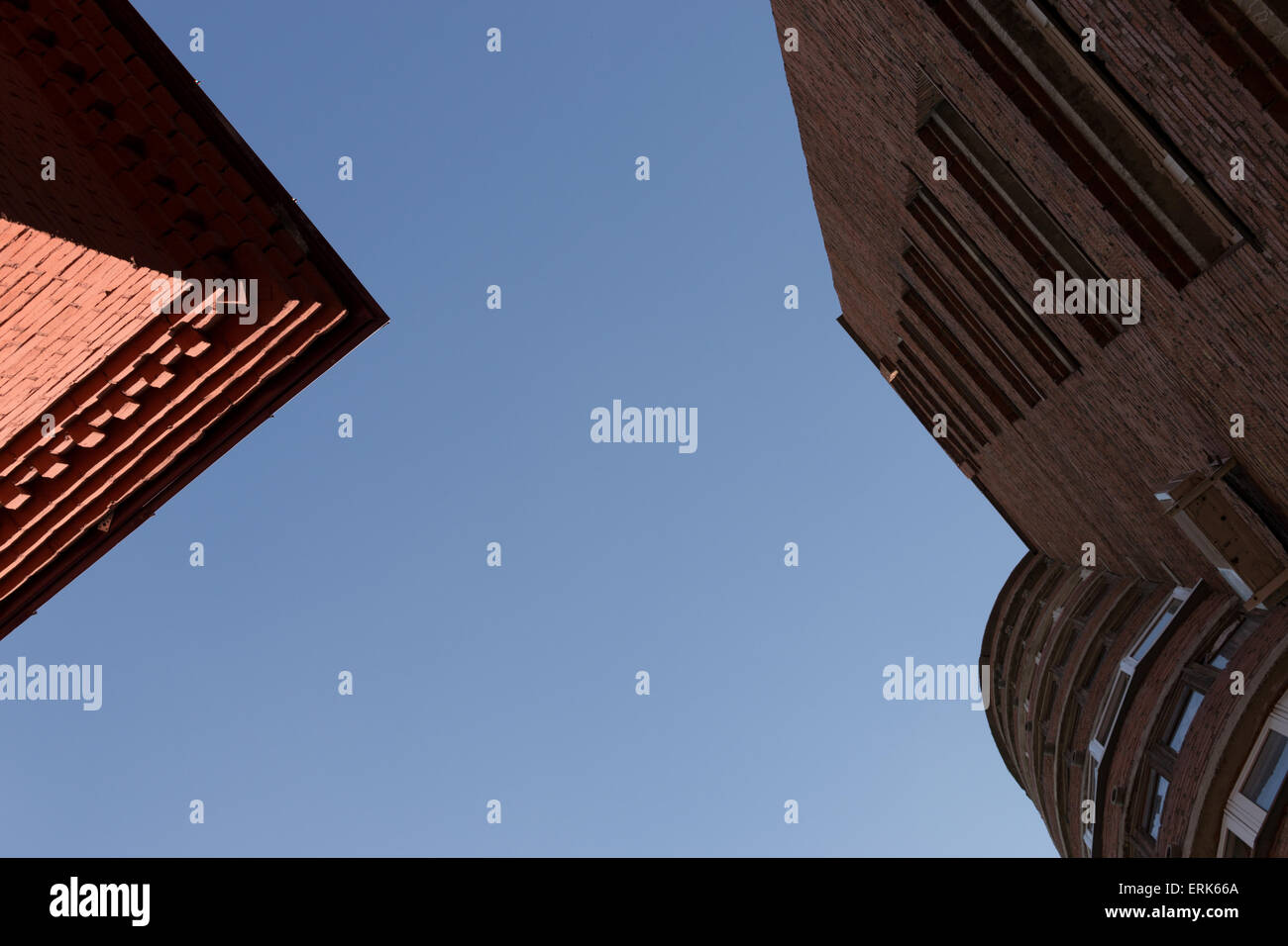 Two opposing buildings create a strong diamond shape with shadow Stock ...